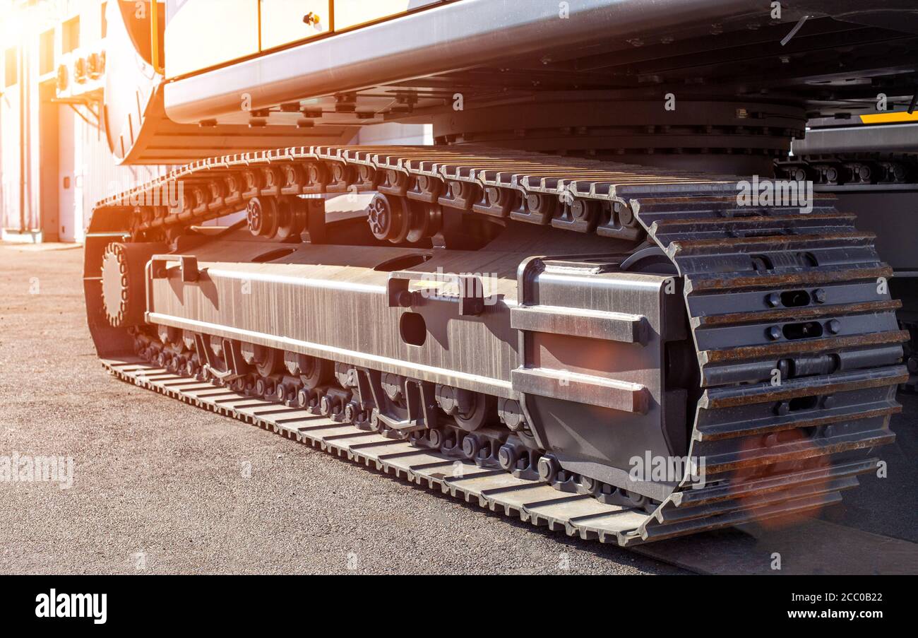 New crawler excavator, close-up, background industry Stock Photo - Alamy