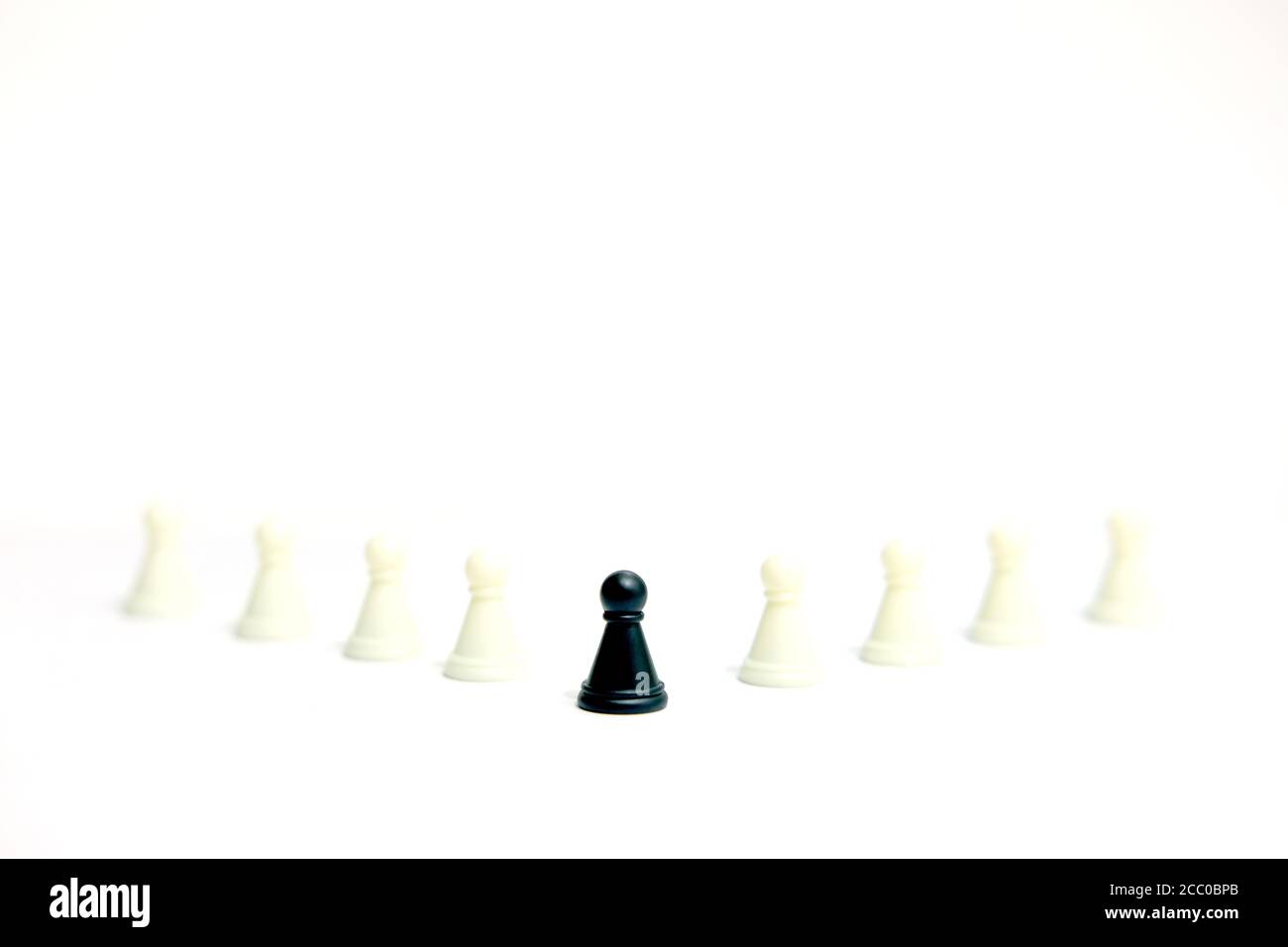 Black pawn piece on white pawn line isolated on white background Stock ...