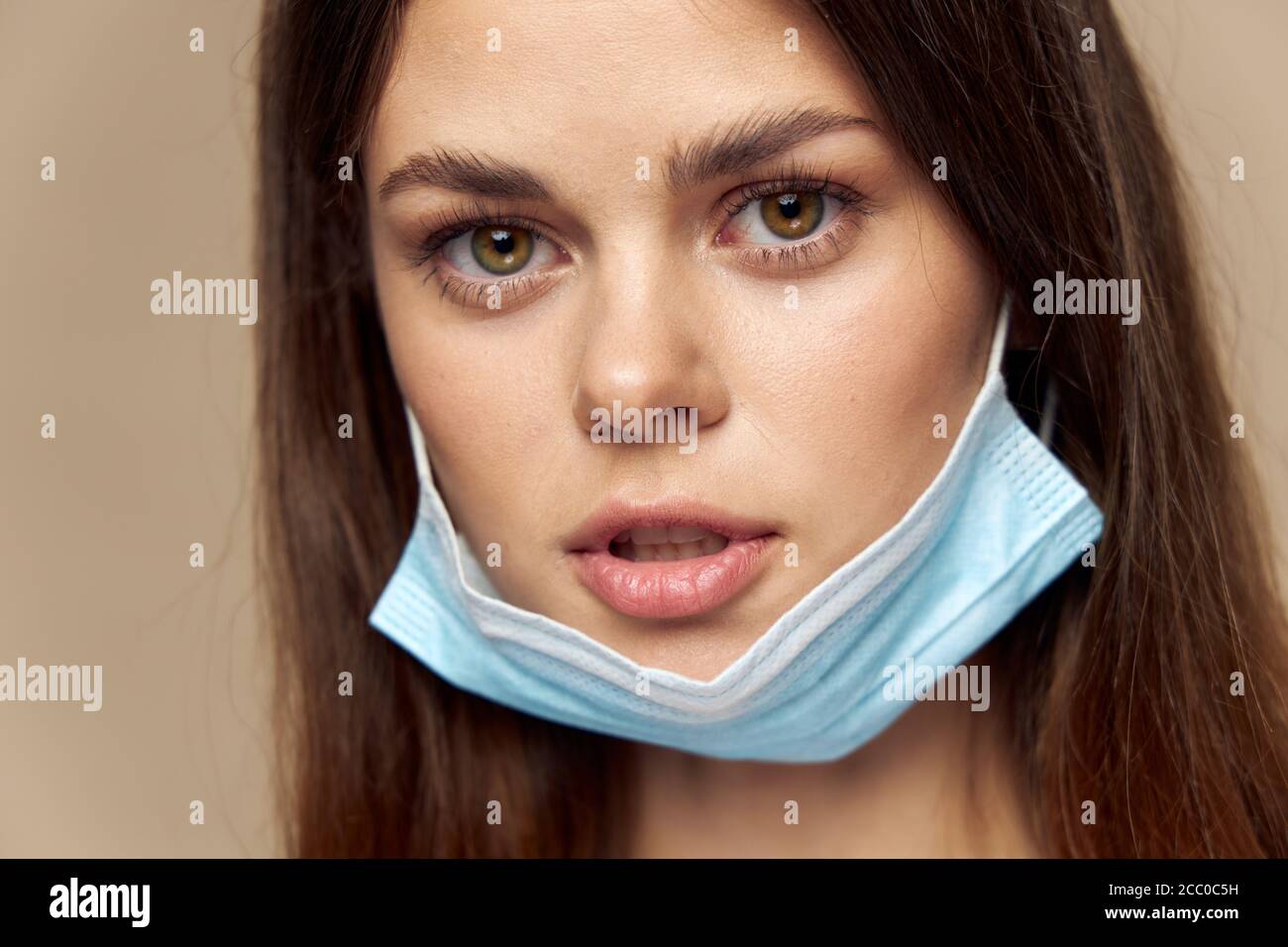 Portrait of a woman with a medical mask on her face, open lips Stock ...
