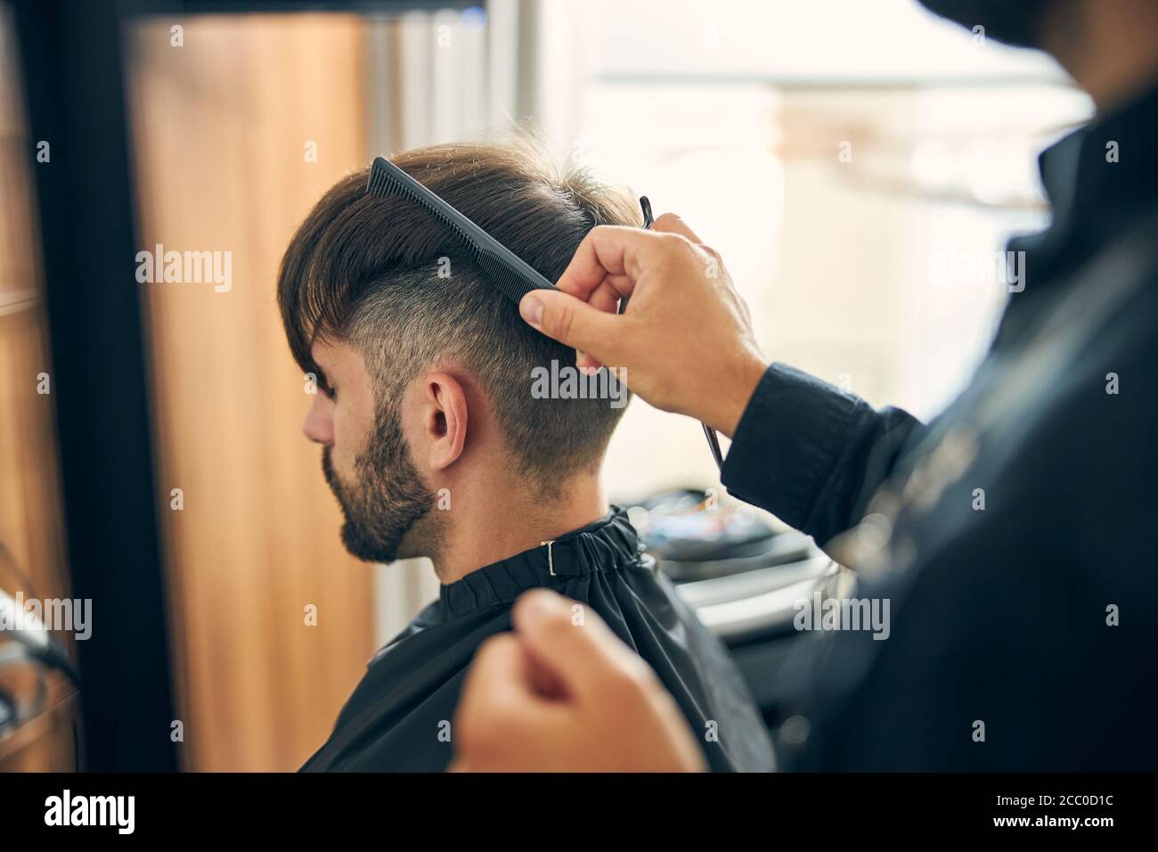 Male hairdresser using comb scissors hi-res stock photography and ...