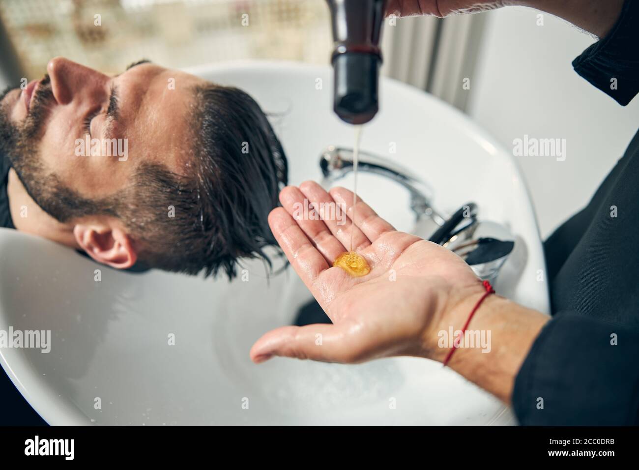 Pouring shampoo hi-res stock photography and images - Alamy