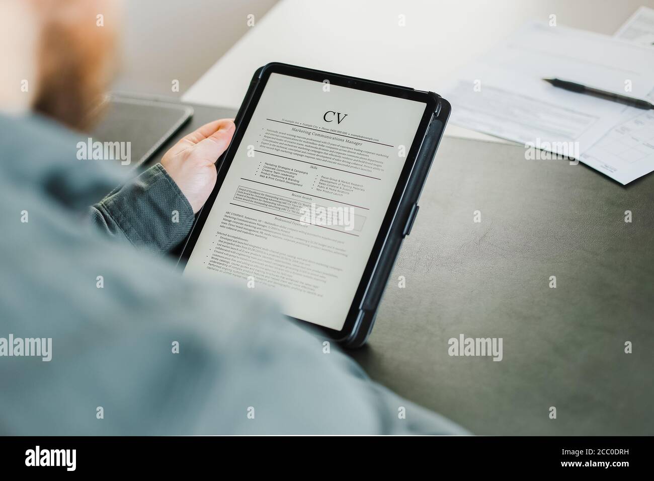 Bearded businessman review electronic cv on tablet Stock Photo - Alamy