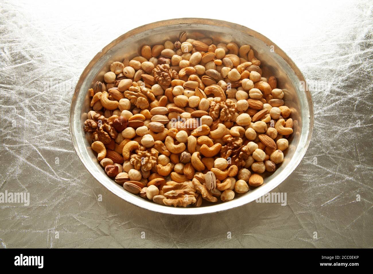 mixed nuts in copper plate Stock Photo - Alamy