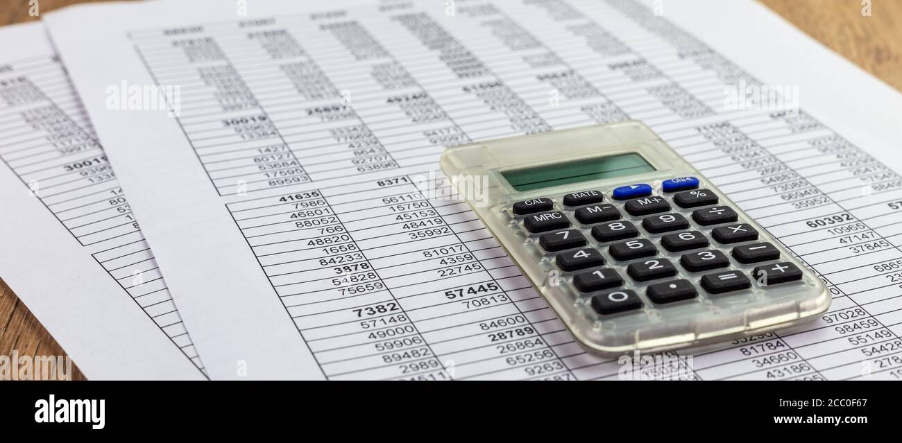 calculator over financial spreadsheet table numbers.. Conceptual for ...