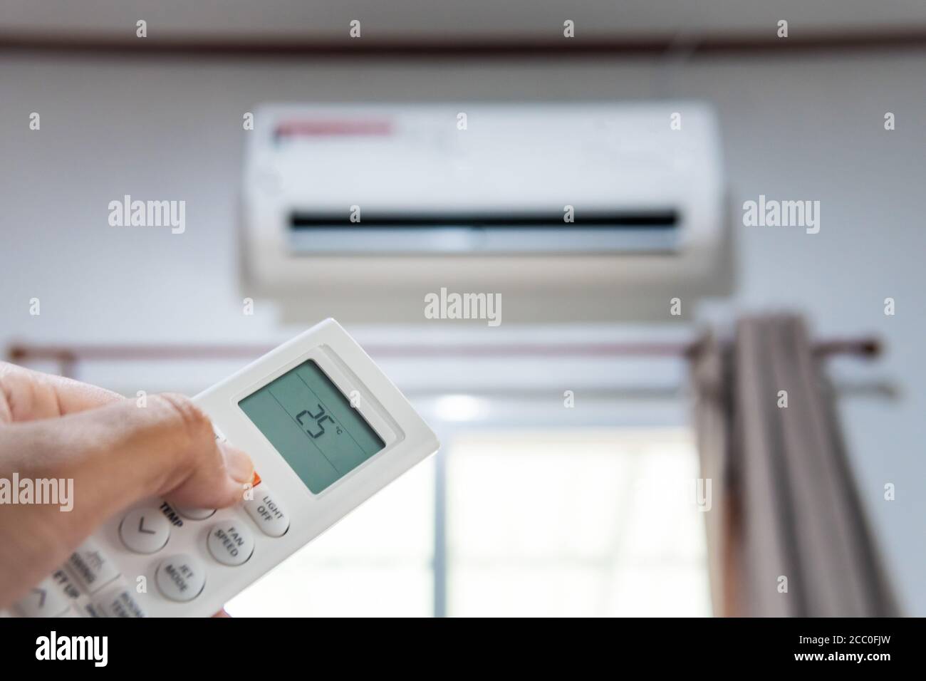 Air condition control by using remote control Stock Photo - Alamy
