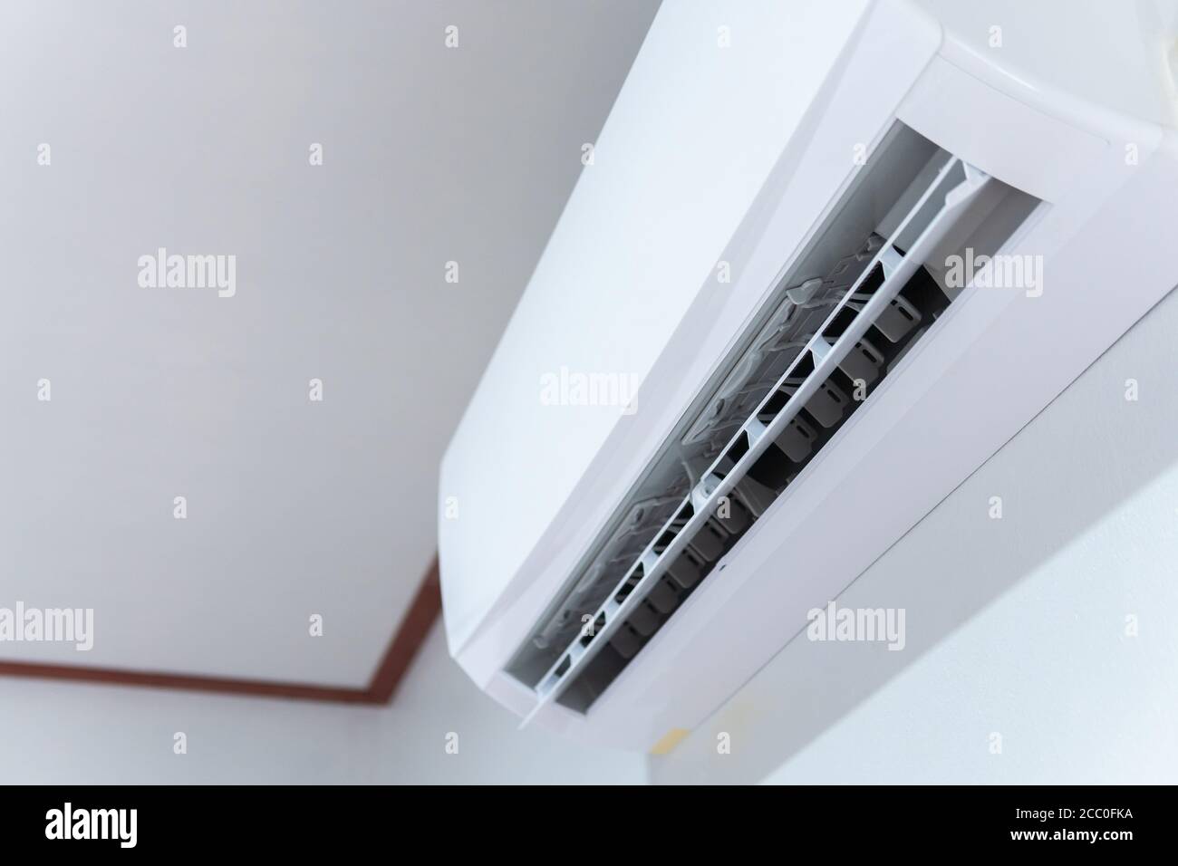 cool air conditioner system on white wall room Stock Photo - Alamy