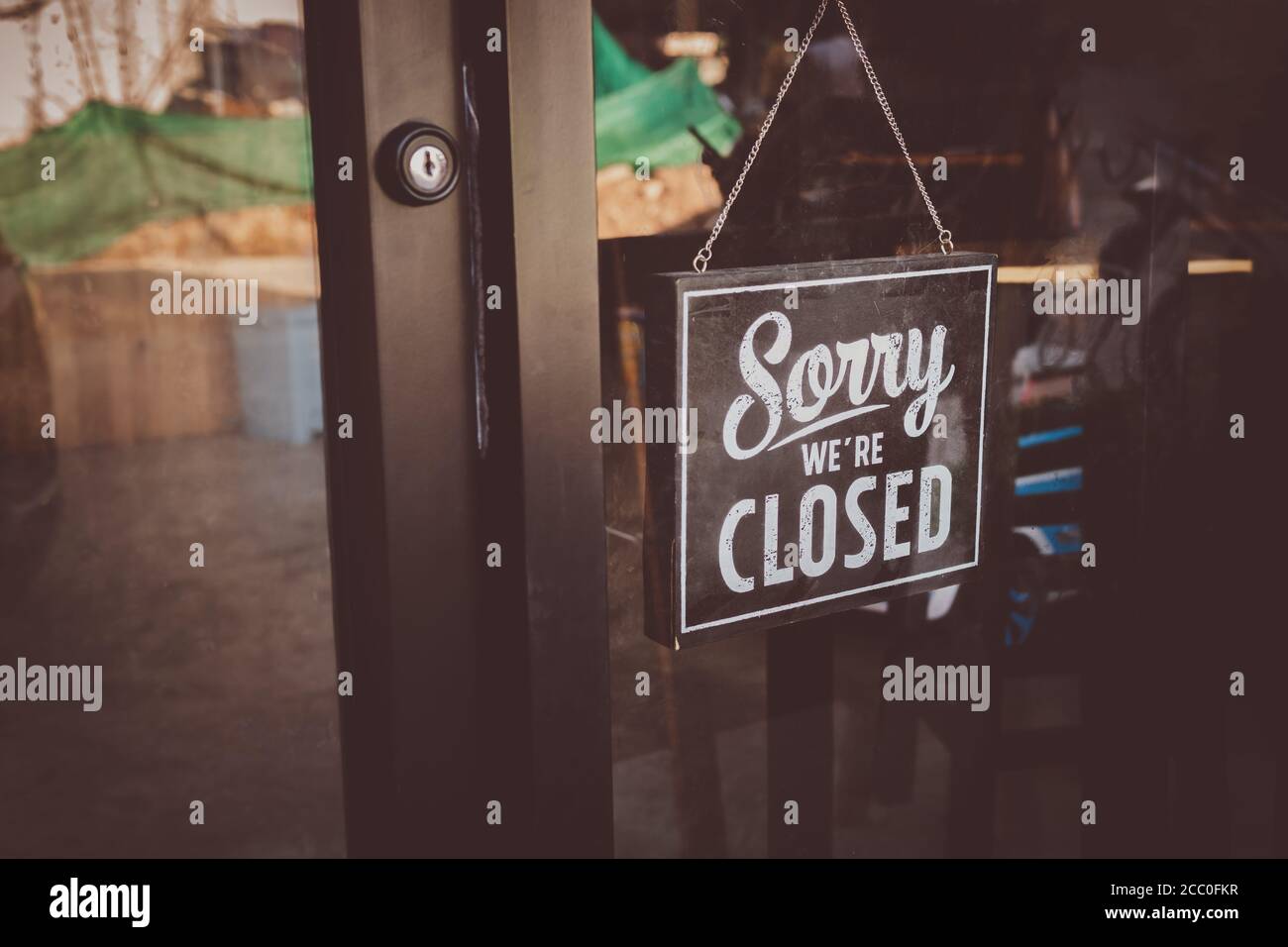 Label 'Sorry we're closed' notice sign wood board hanging on door front ...