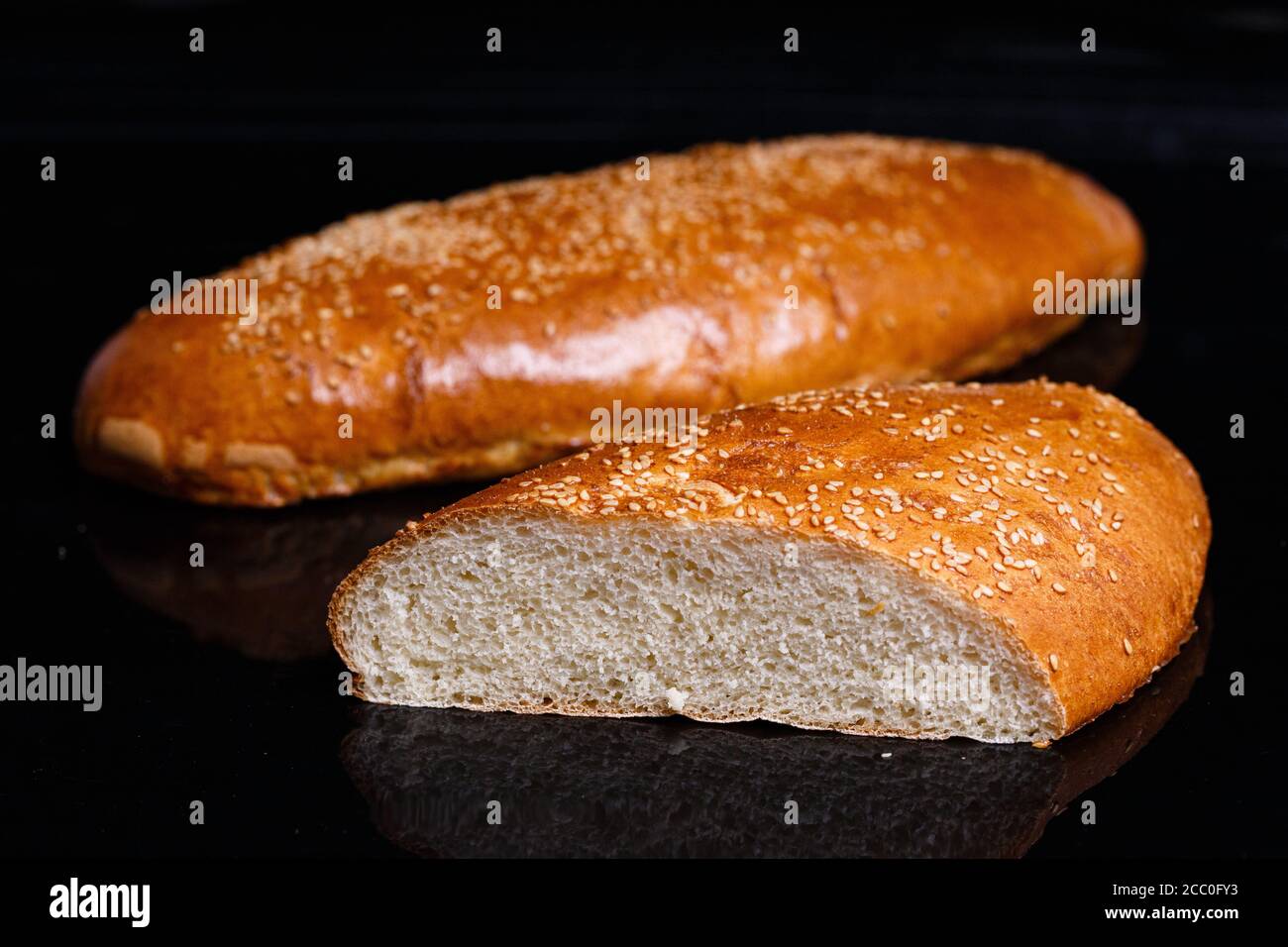 Homemade pastries. Crispy white bread cut with a knife Stock Photo - Alamy