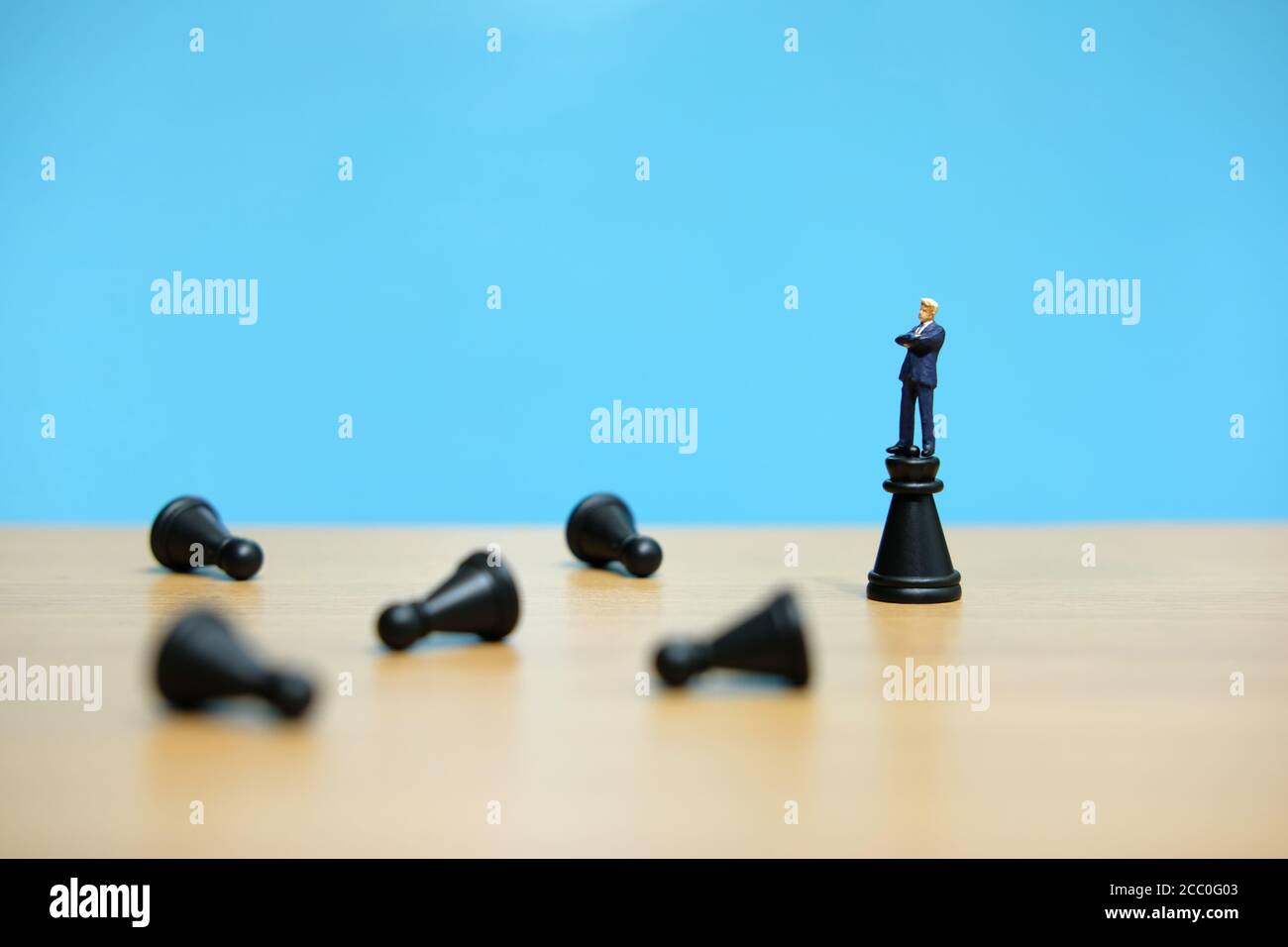 Business strategy conceptual photo - miniature businessman standing on ...