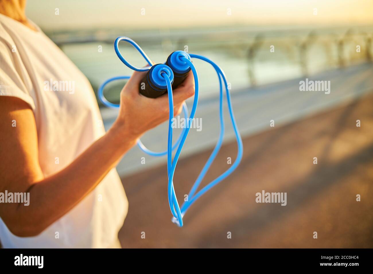 Hand holding skipping rope hi-res stock photography and images - Alamy