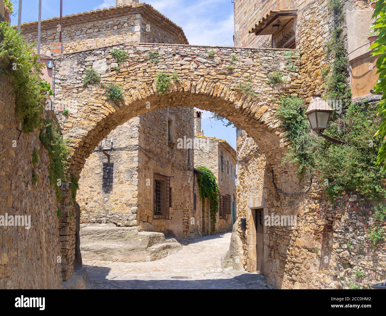 Medieval architecture street in Peratallada town in Catalonia, Spain ...