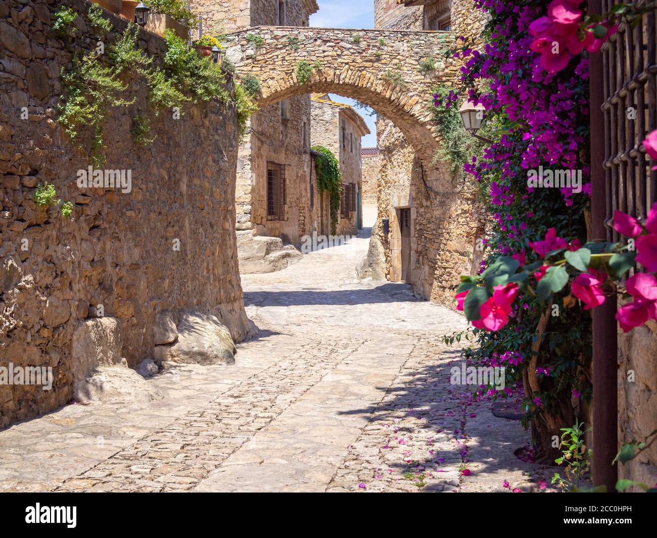 Medieval architecture street in Peratallada town in Catalonia, Spain ...