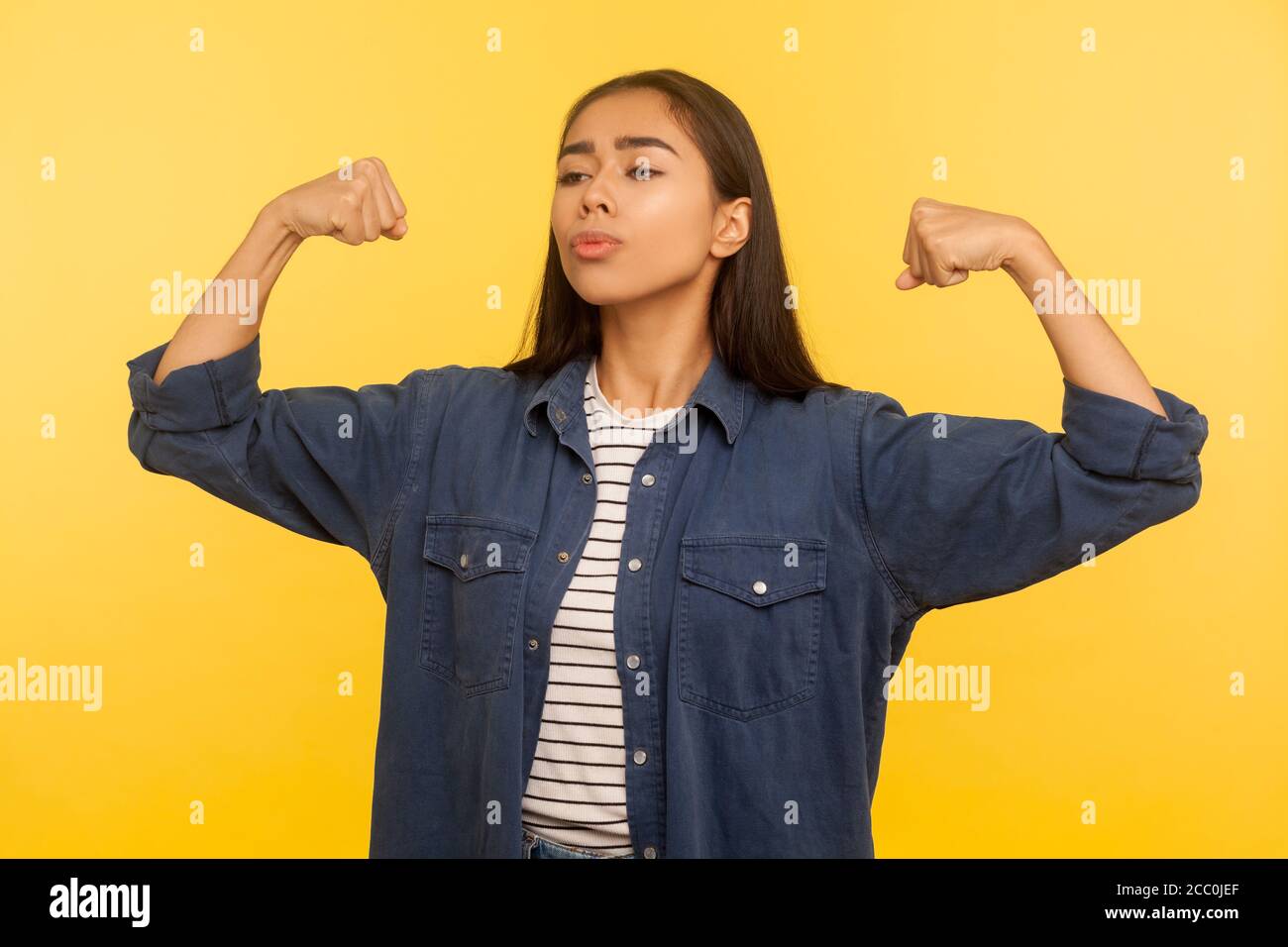 I am strong and independent! Portrait of confident proud girl in denim ...