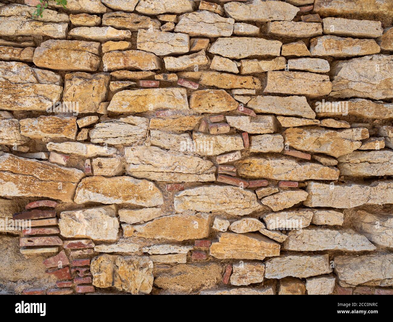 Real antique spanish stone wall background texture Stock Photo - Alamy