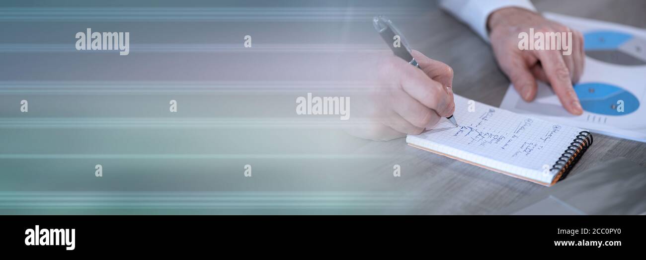 Businessman analysing marketing data and taking notes; panoramic banner ...