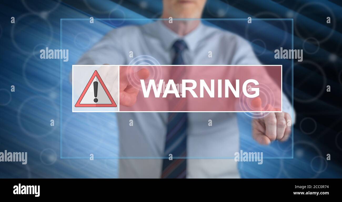 Man touching a warning concept on a touch screen with his fingers Stock ...