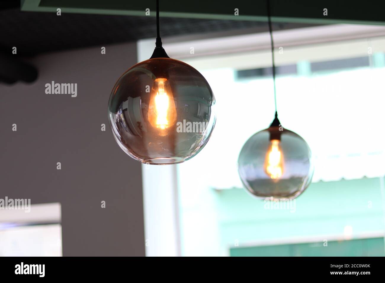 A selective focus closeup shot of modern round light lamps Stock Photo ...