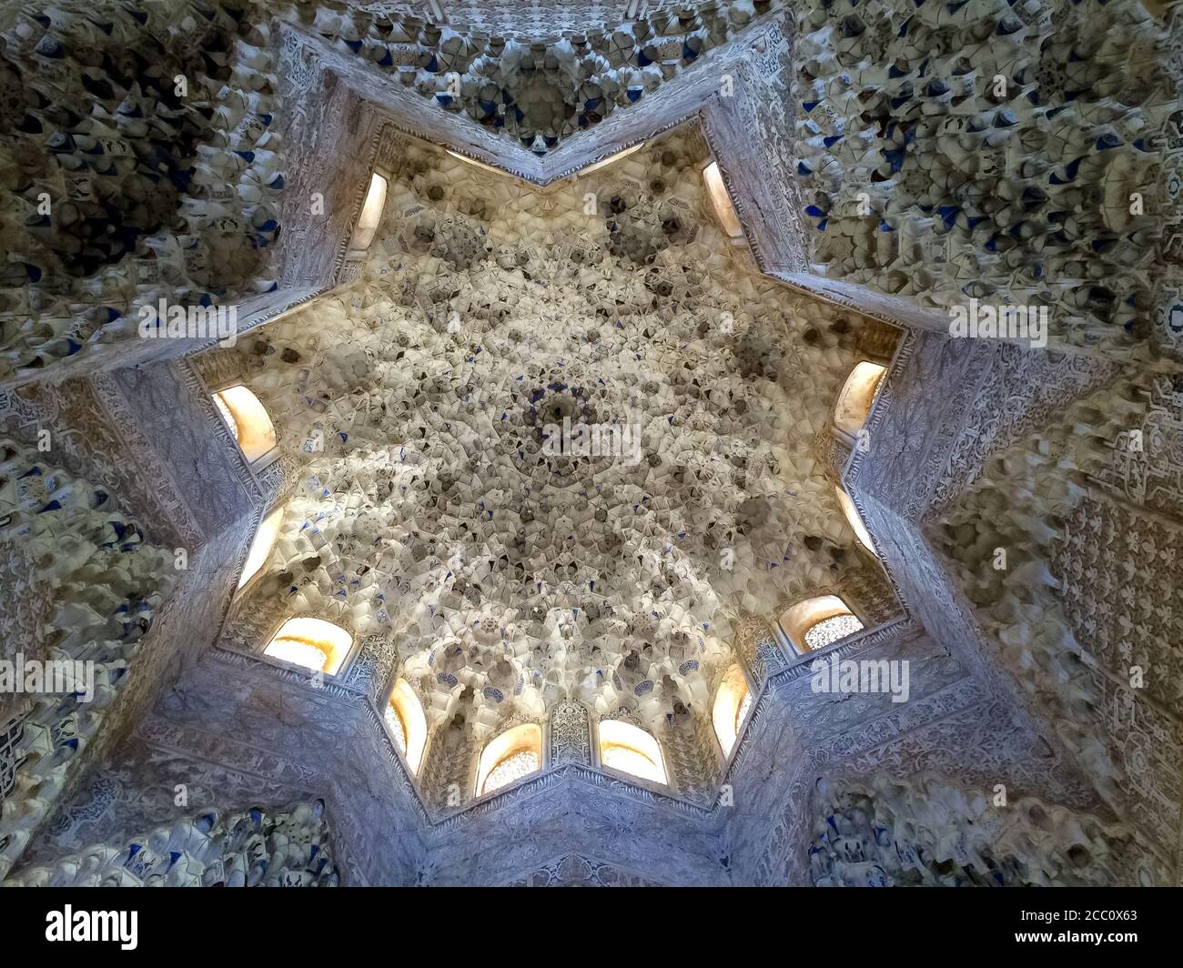 Low angle shot of an eight-pointed star-shaped roof with many windows ...