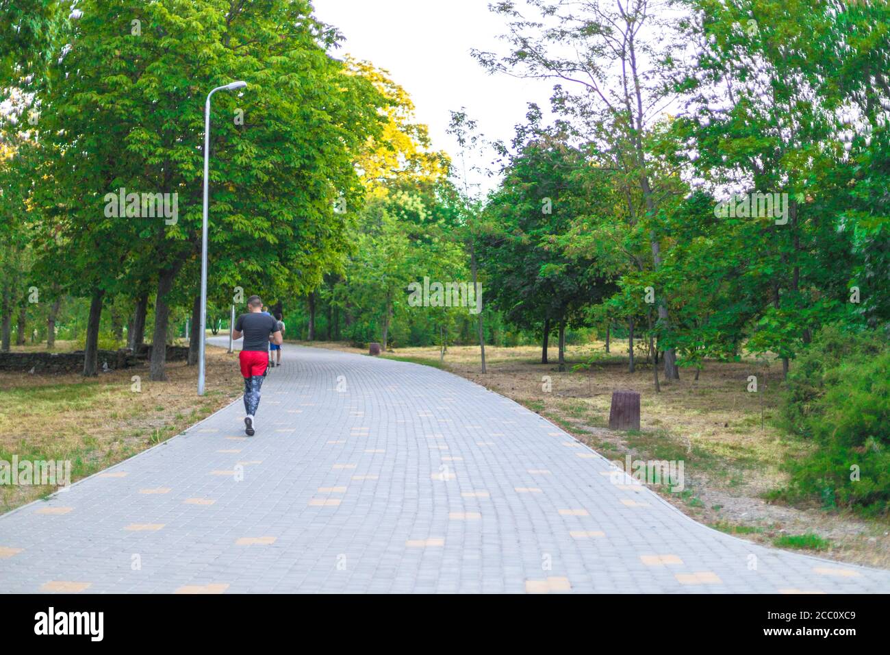 Park man running park in the morning. Health and fitness outdoor ...