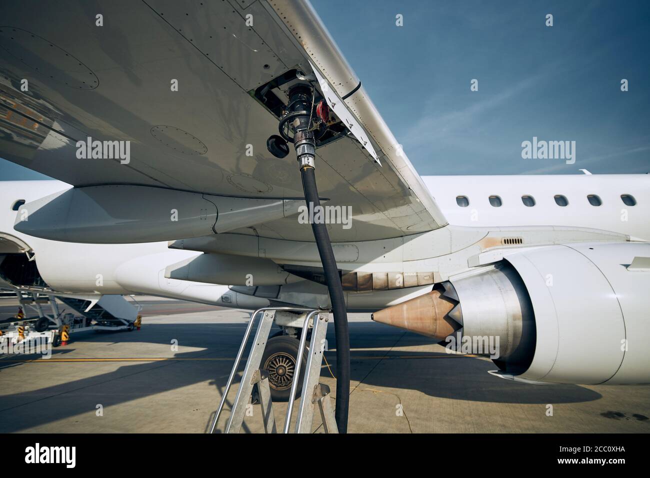 Ground service before flight. Refueling of airplane at airport Stock ...