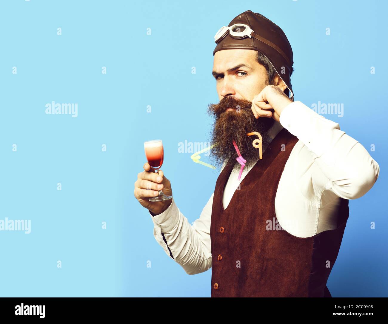handsome bearded pilot or aviator man with long beard and mustache on ...