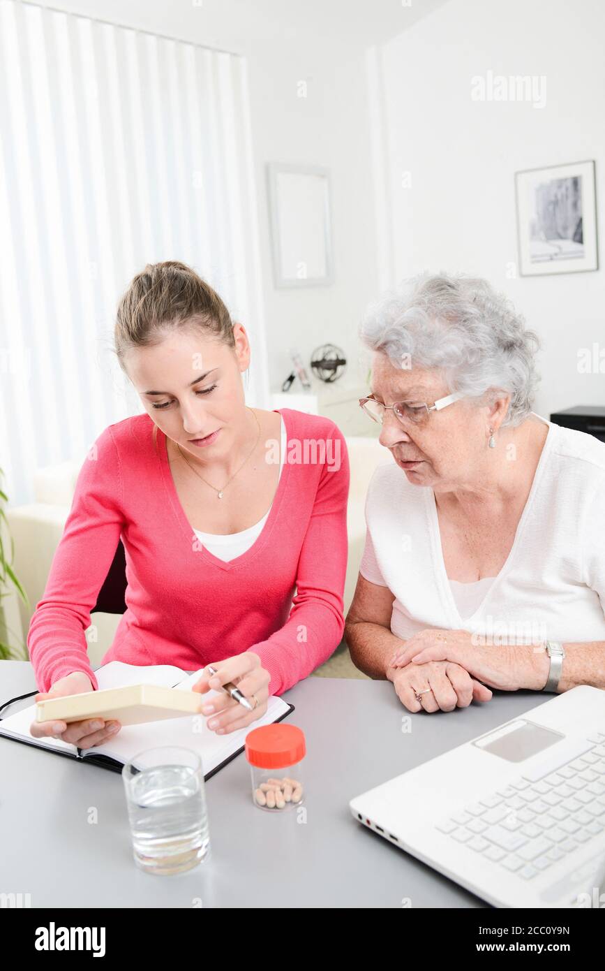 Helping elderly woman hi-res stock photography and images - Alamy