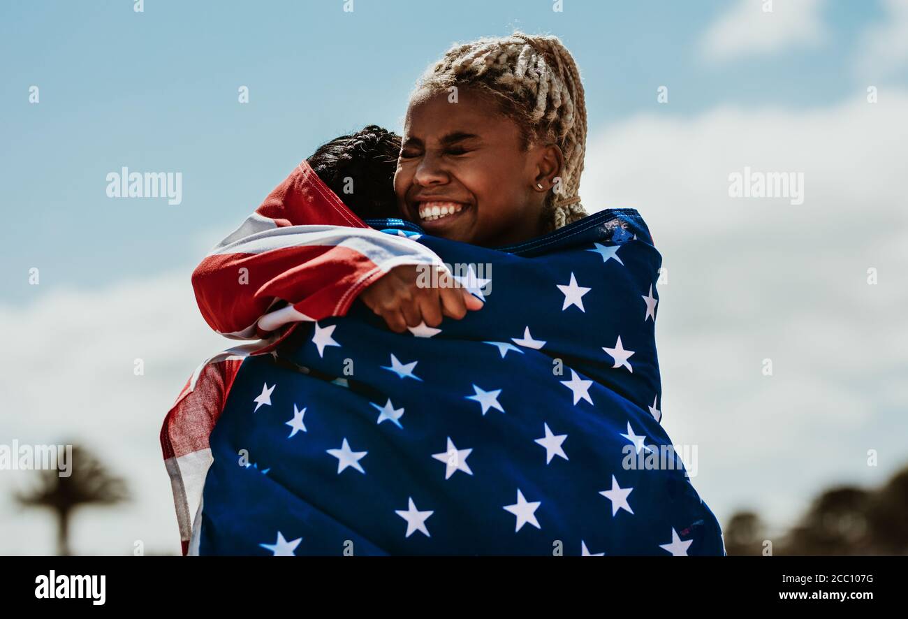 Two american woman athletes giving a hug to another after winning the ...