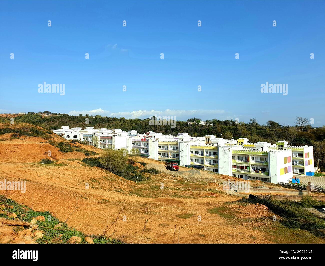 Public white flats in samba district vies of blue sky and brown land ...