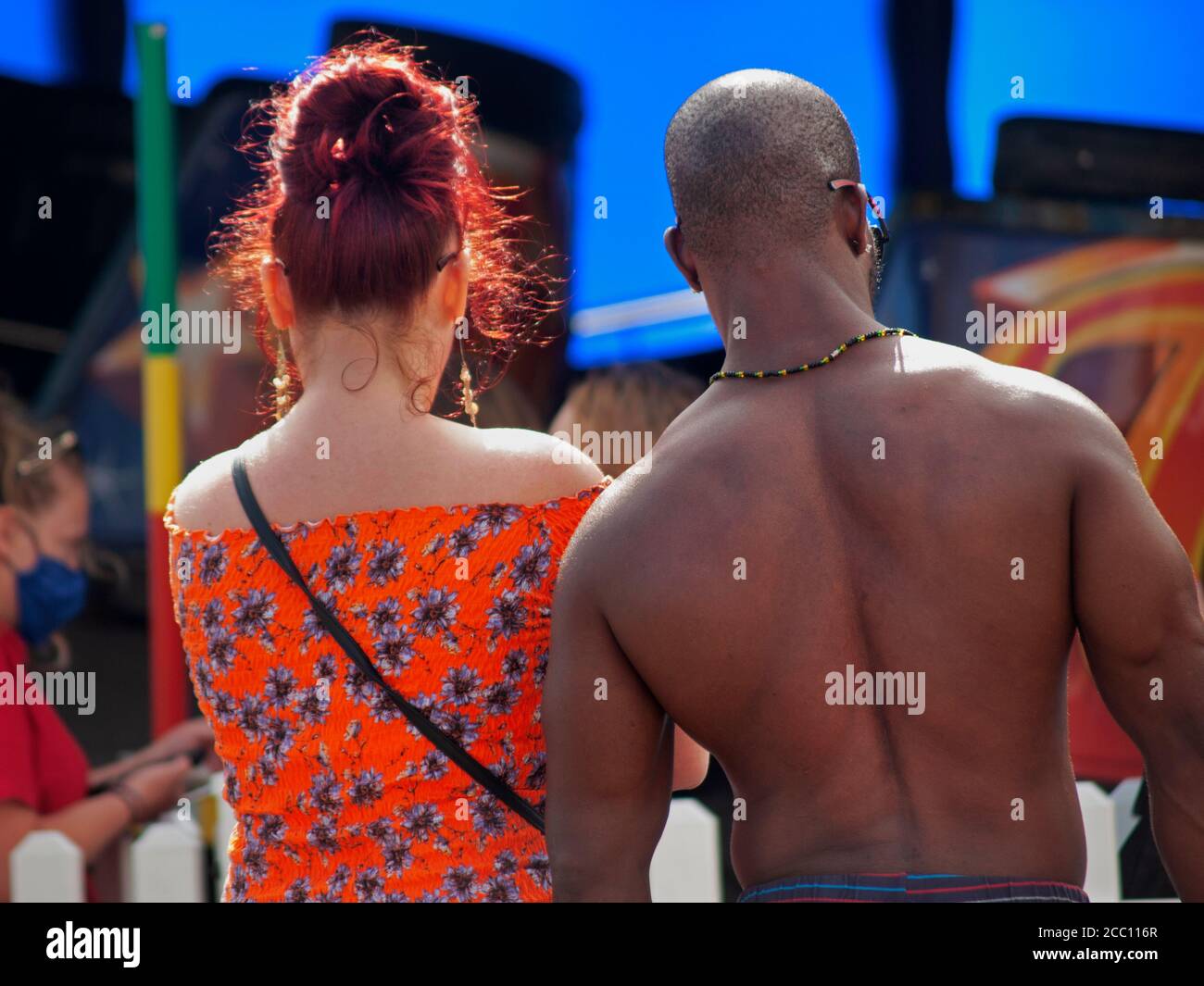 A broad shouldered man with his girlfriend in Brighton Stock Photo - Alamy