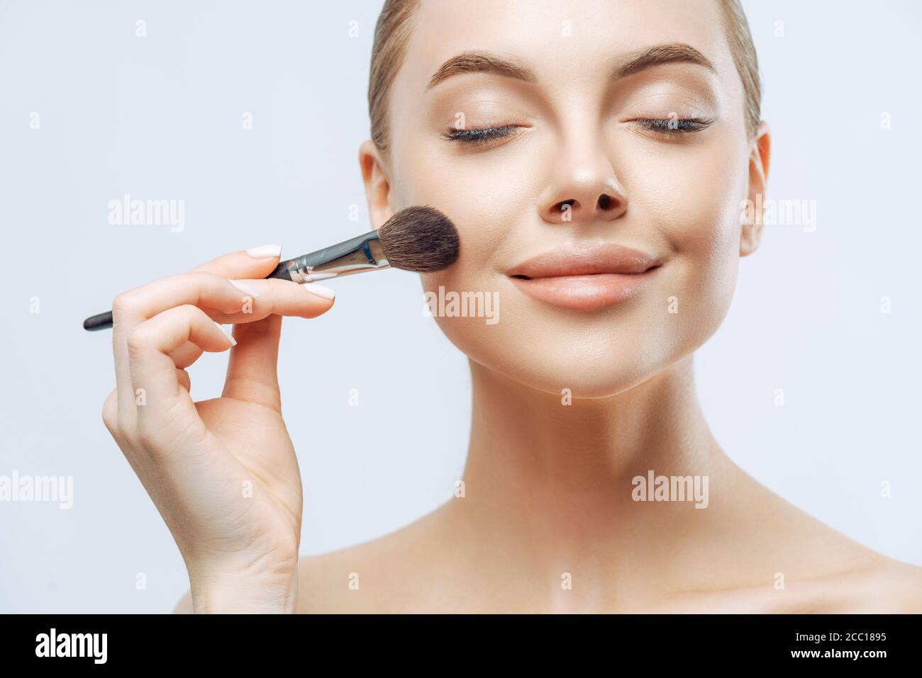 Close up portrait of beautiful girl has fresh healthy skin, closes eyes ...