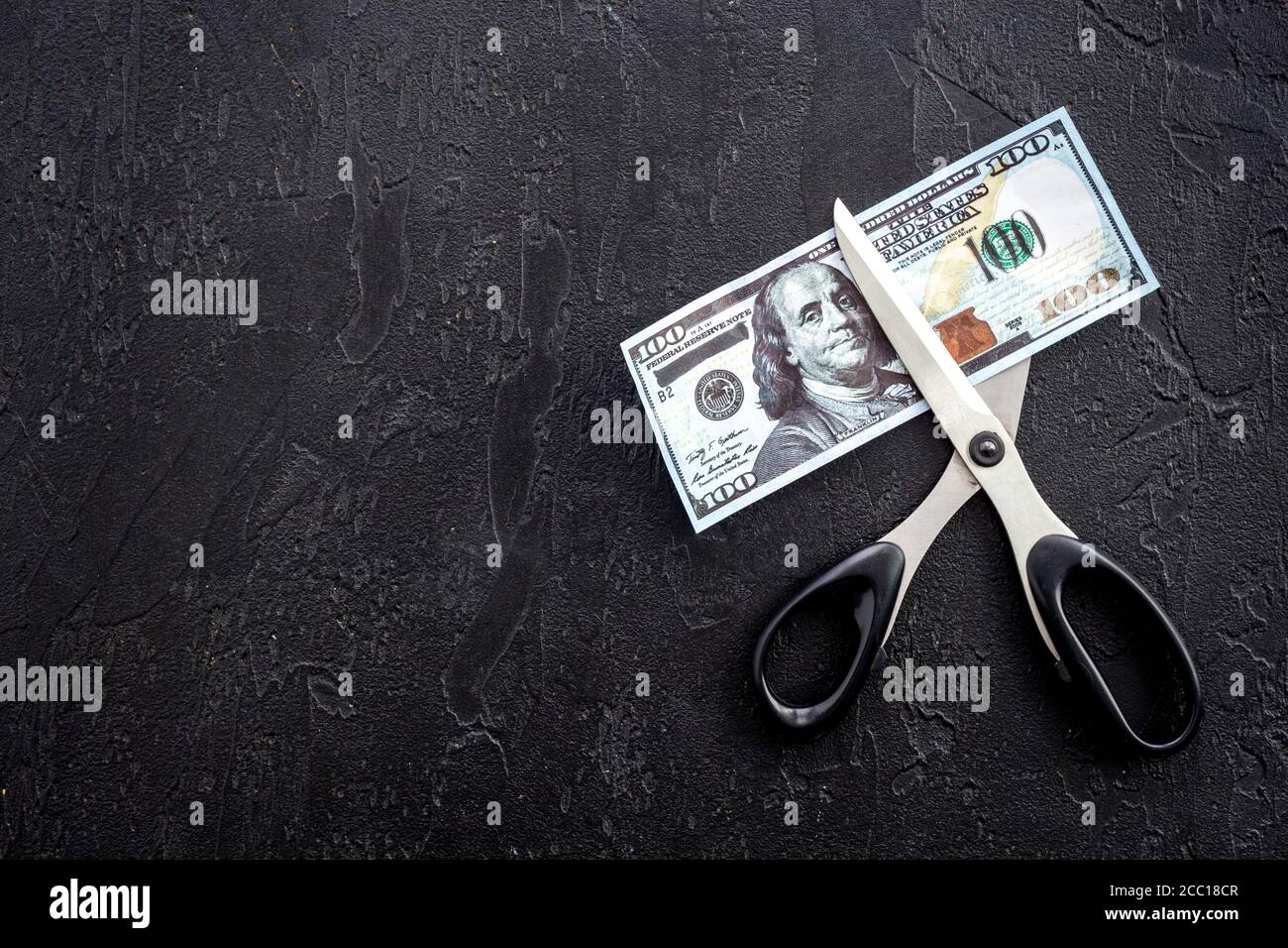 Cutting of US dollar banknote. Economic crisis concept Stock Photo - Alamy