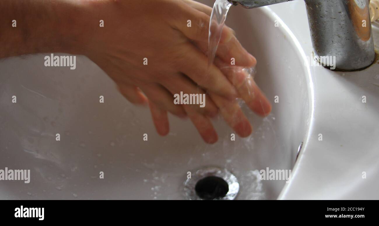 Man washes hands in clean hi-res stock photography and images - Alamy