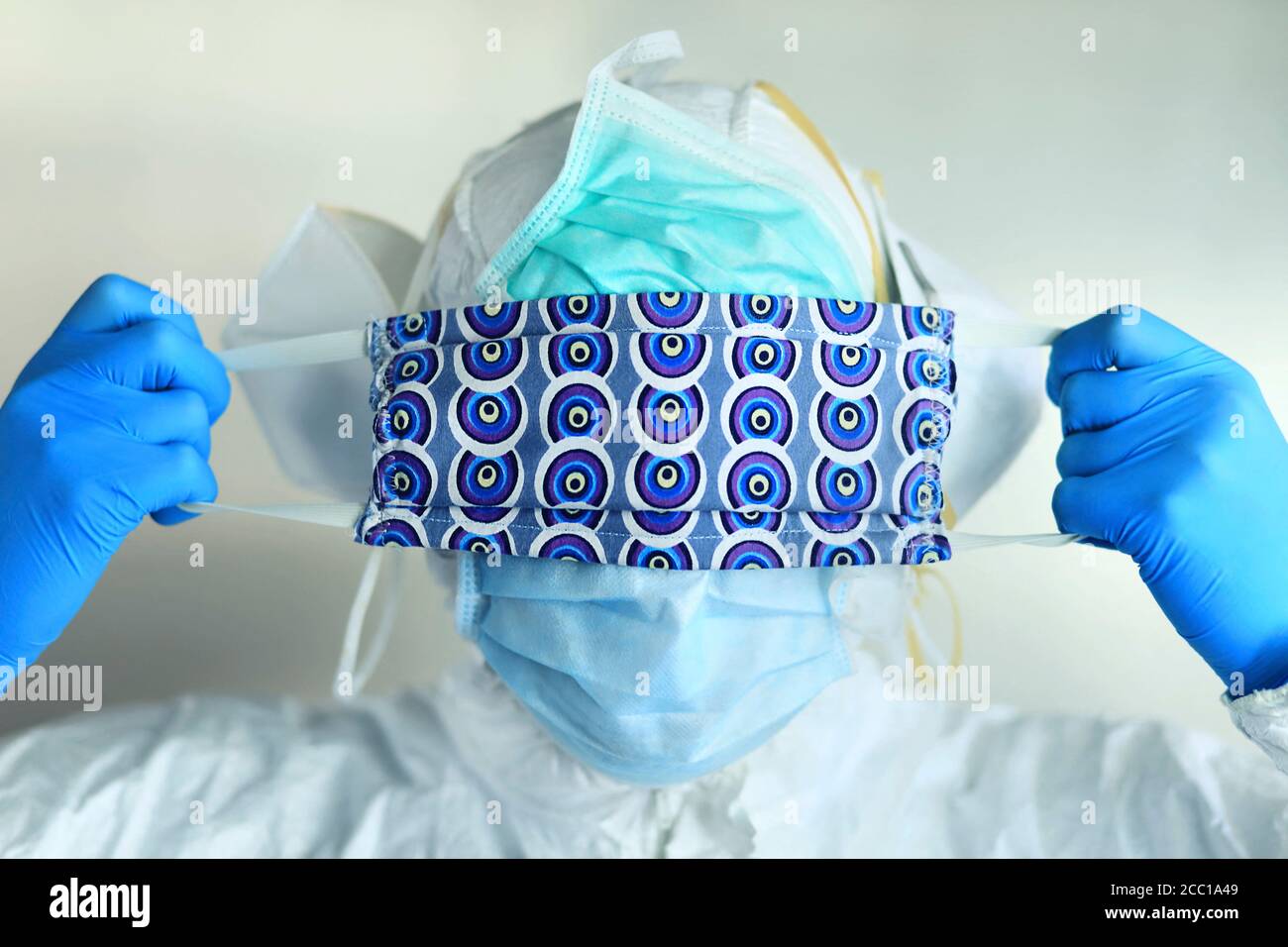 Protection against coronavirus. Alternative fabric mask. Man with ...