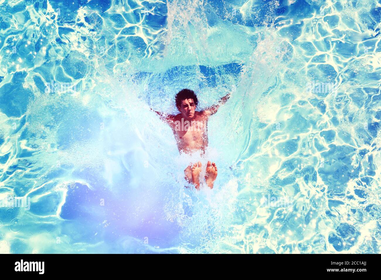 Young man falling into a swimming pool Stock Photo - Alamy