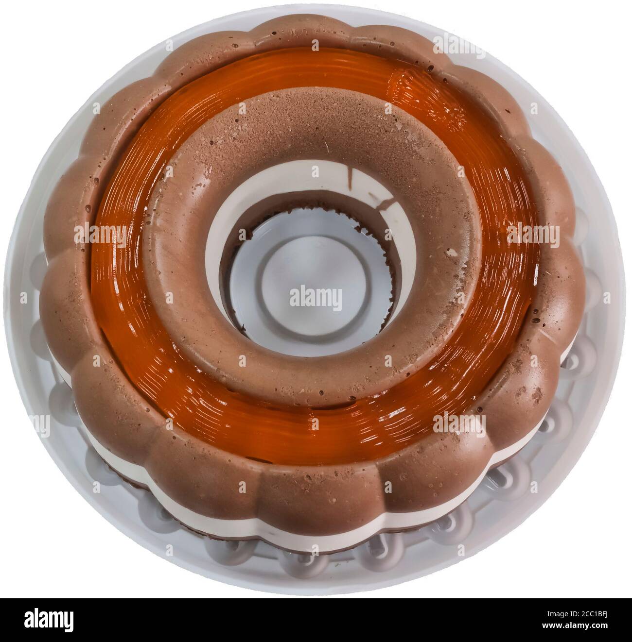 Chocolate-curd jelly cake on a plastic stand. Isolated Stock Photo - Alamy