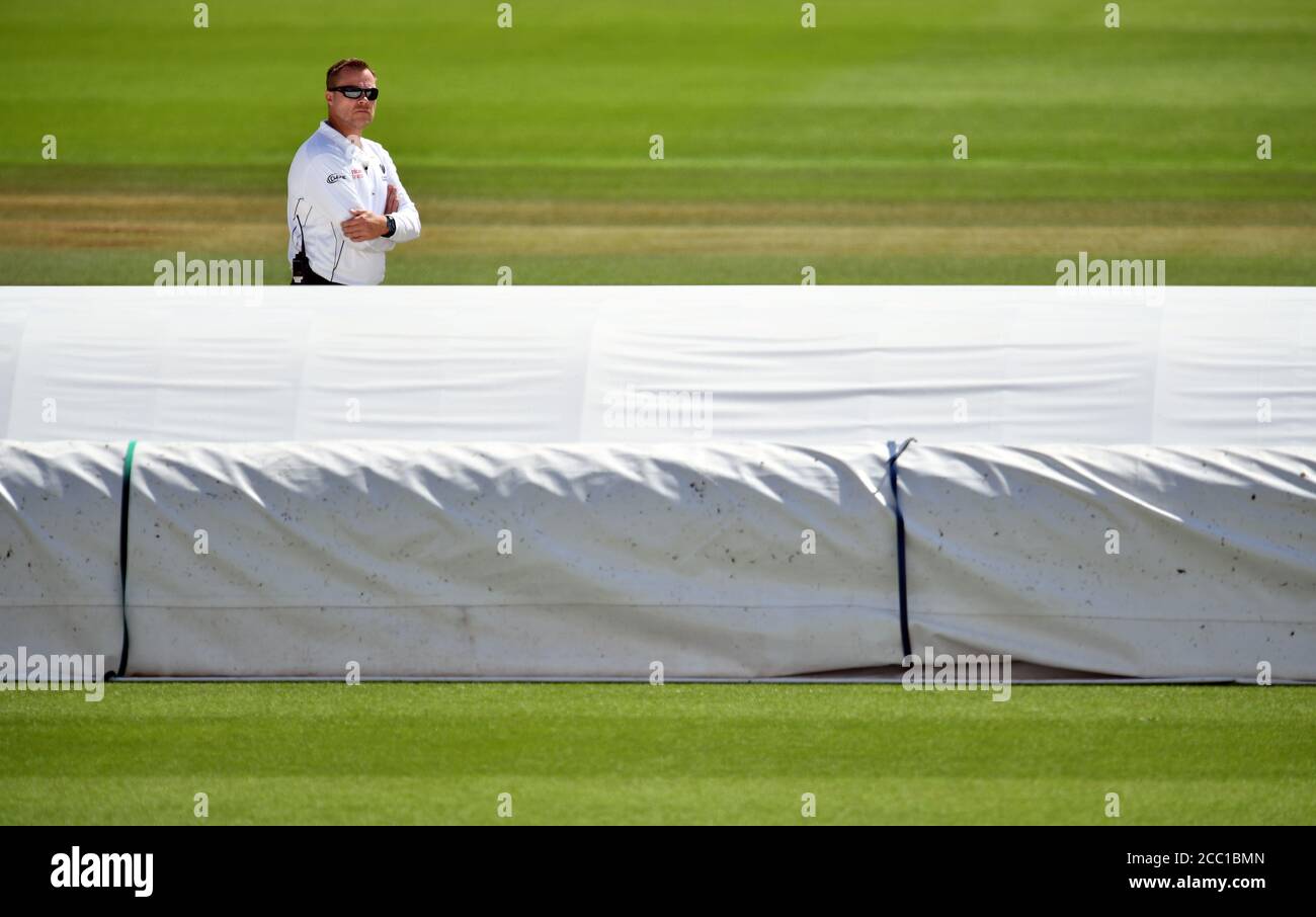 Umpire Martin Saggers joins the other umpires to conduct their third ...