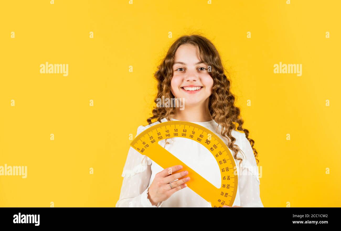 Measure angles in degrees. School lessons. Adorable cute pupil. She ...