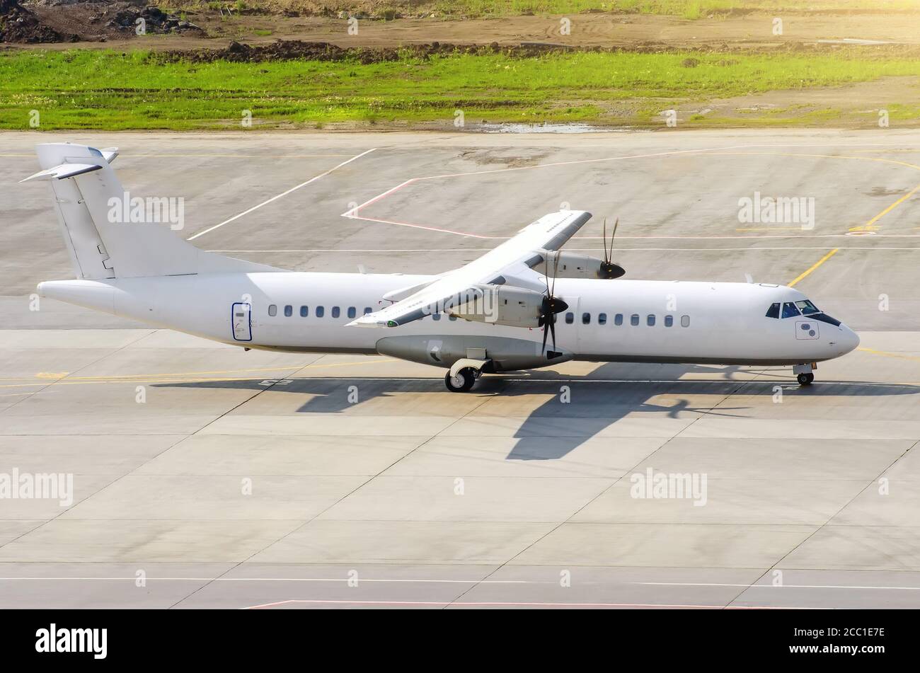 Passenger turboprop airplane taxi for takeoff at the airport Stock ...