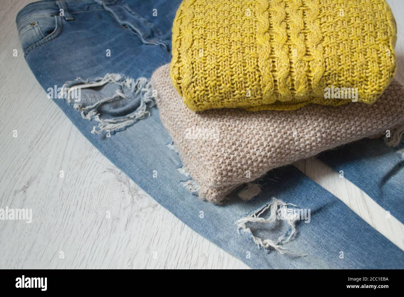 Two sweaters on jeans. Collage. Fashionable concept Stock Photo - Alamy