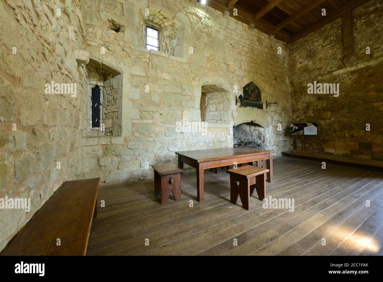 Antique hall with fireplace and table in an ancient building hi-res ...