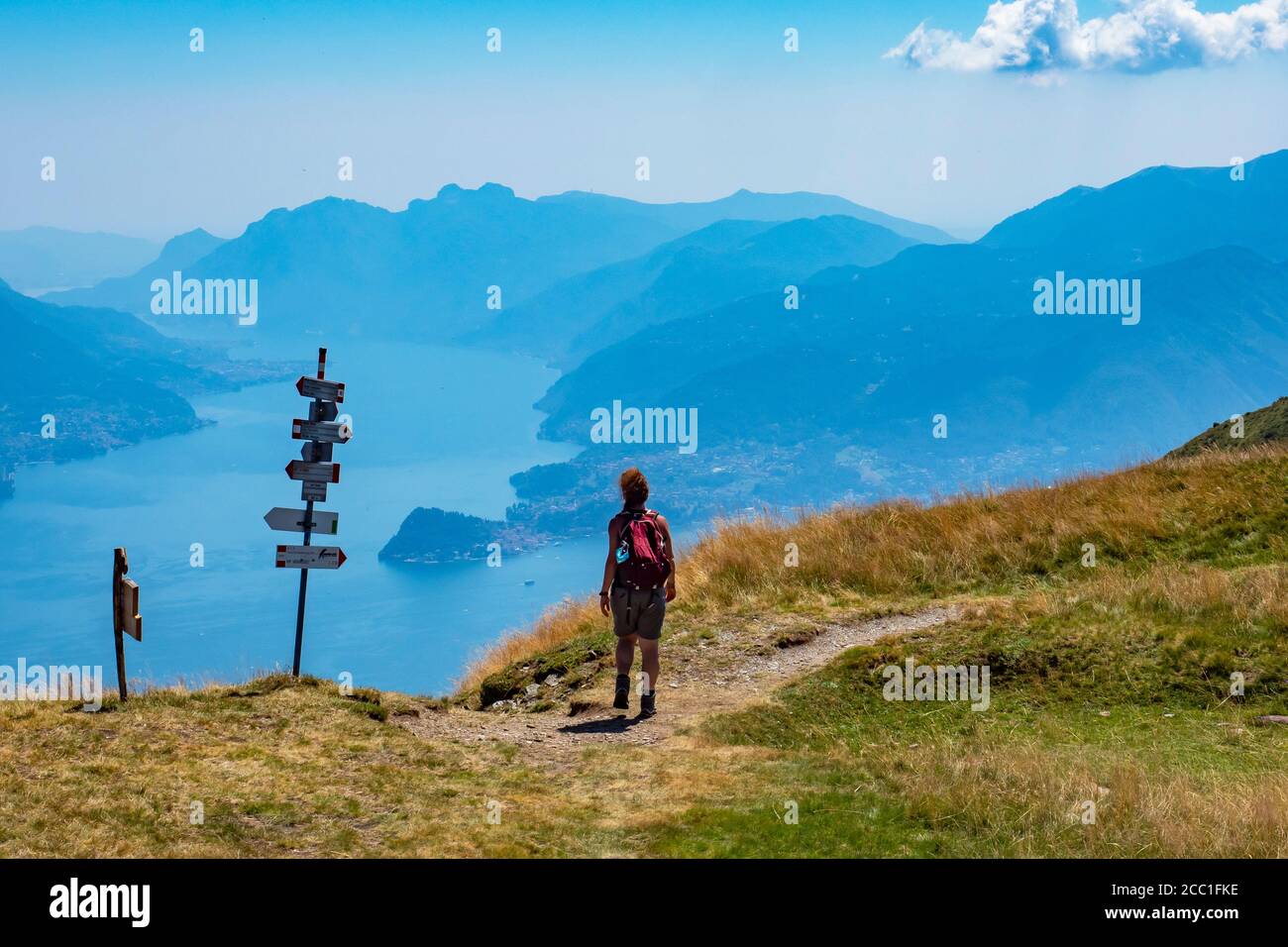 Trekking scene on Lake Como alps (the arrows indicates the names of the ...