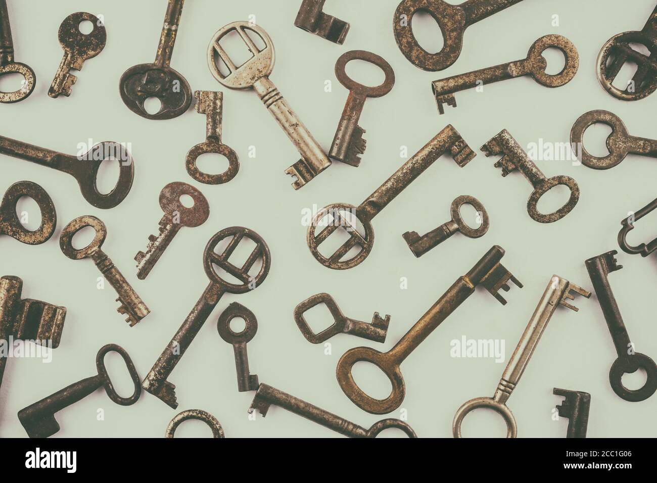 Retro styled pattern of different old rusted keys Stock Photo - Alamy
