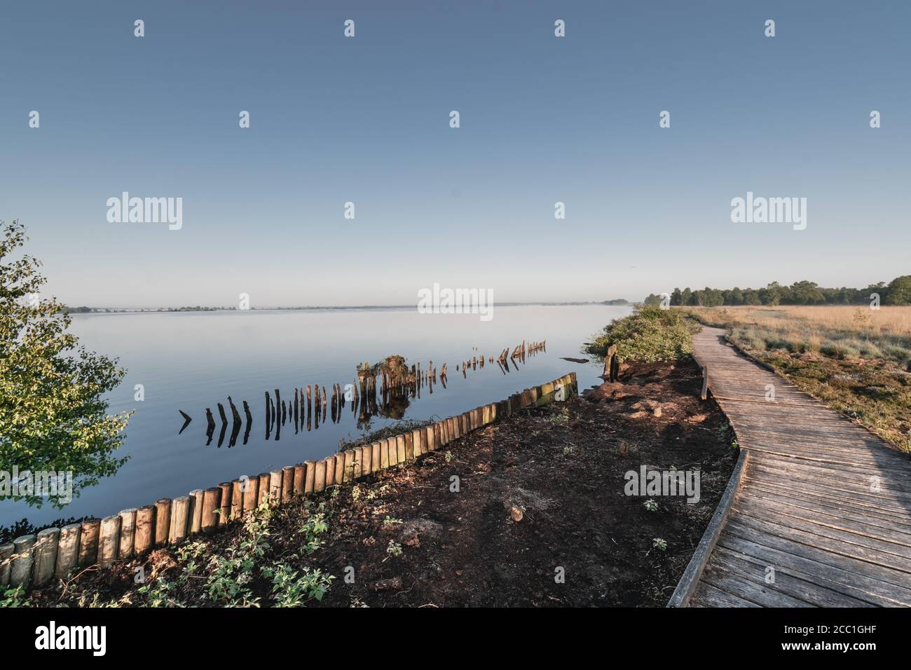 Landscape shot of a field near a lake Stock Photo - Alamy