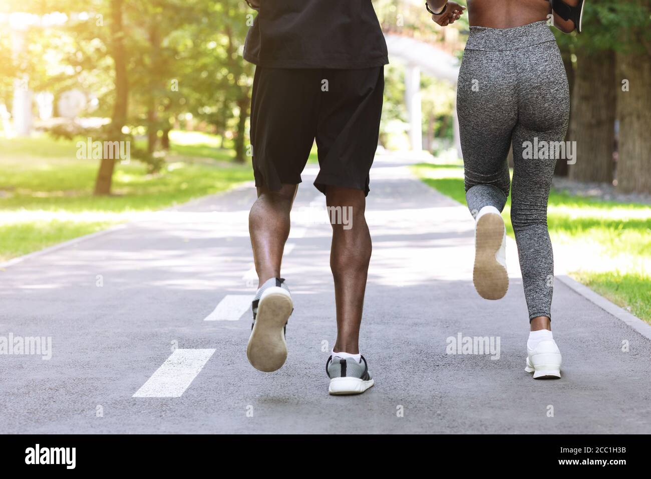 Personal Training Outdoors. Black Woman Running In Morning Park With ...