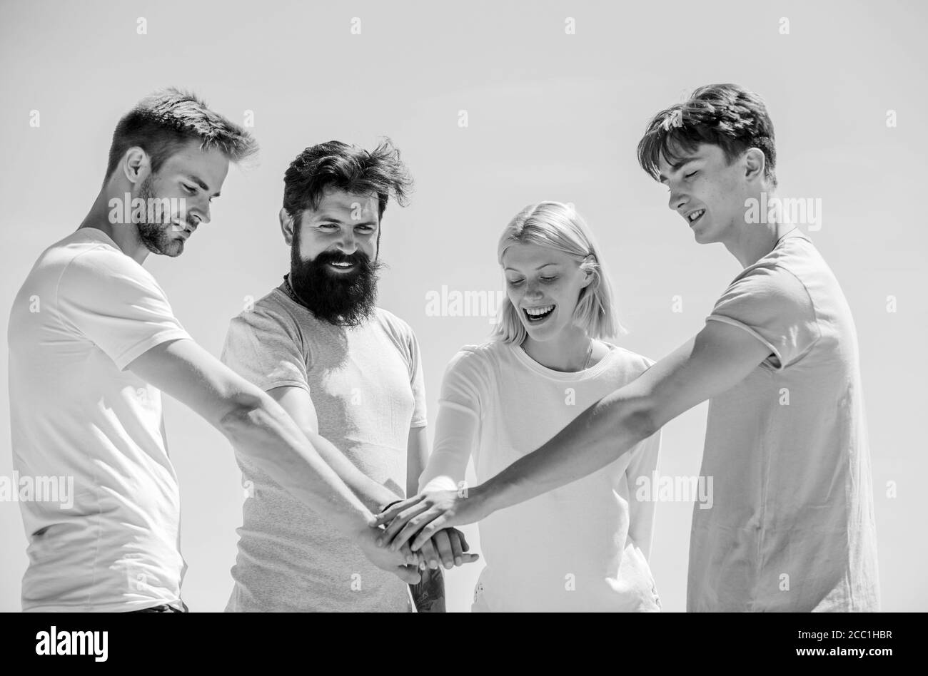 Business team. Community member. cheerful guys and girl. group of four ...