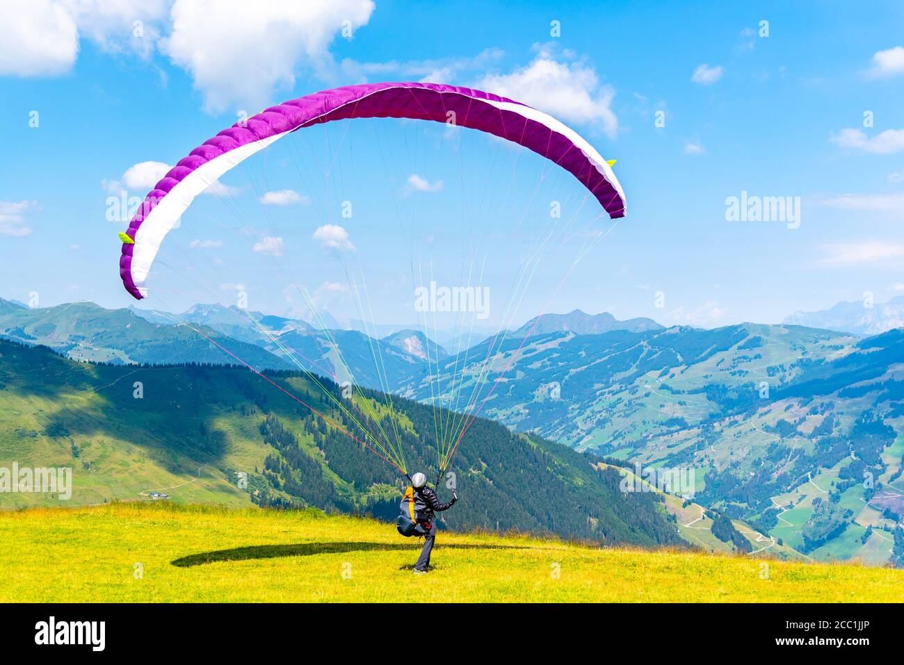 Paraglide launching. Starting procedure of paraglider on high mountain ...
