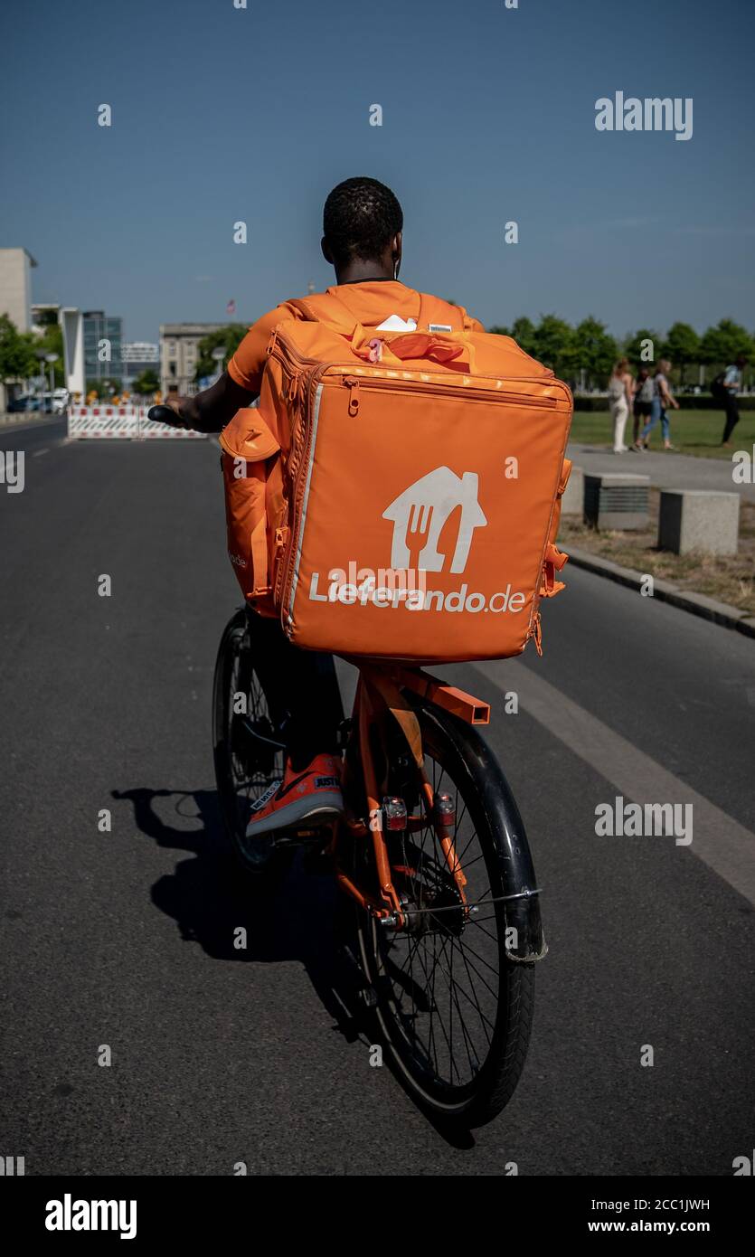 Berlin, Germany. 17th Aug, 2020. A courier of the food delivery service ...