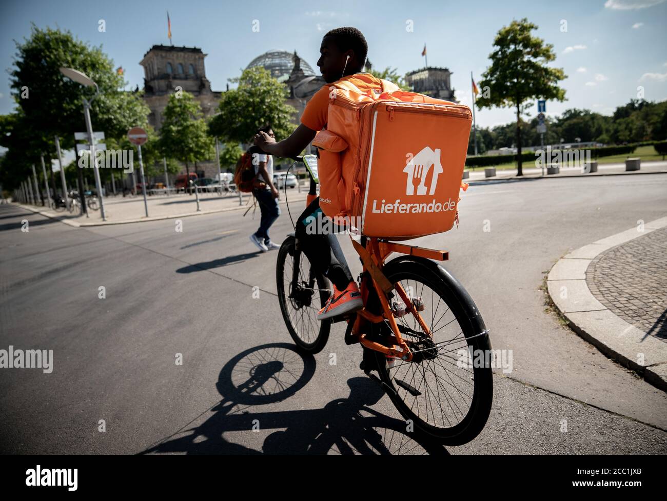 Berlin, Germany. 17th Aug, 2020. A courier of the food delivery service ...