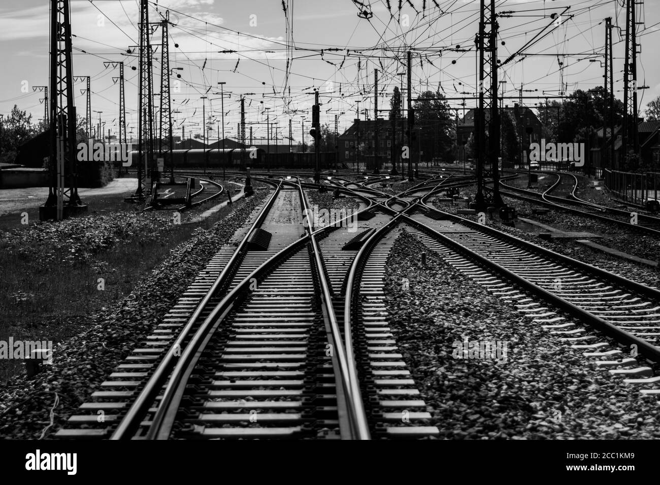 Grayscale shot of train rail tracks Stock Photo - Alamy