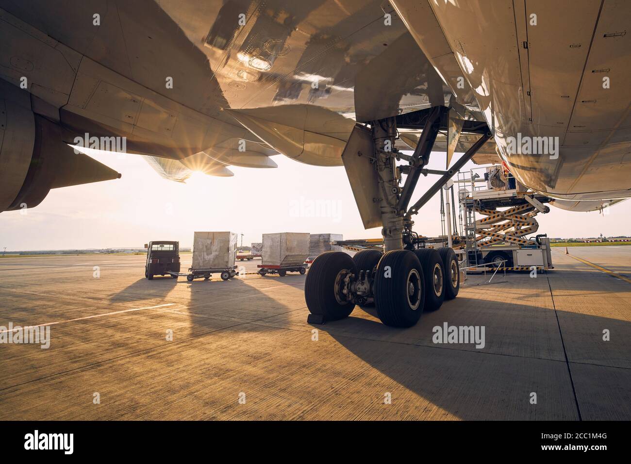 Preparation before flight. Loading of cargo containers to airplane at ...